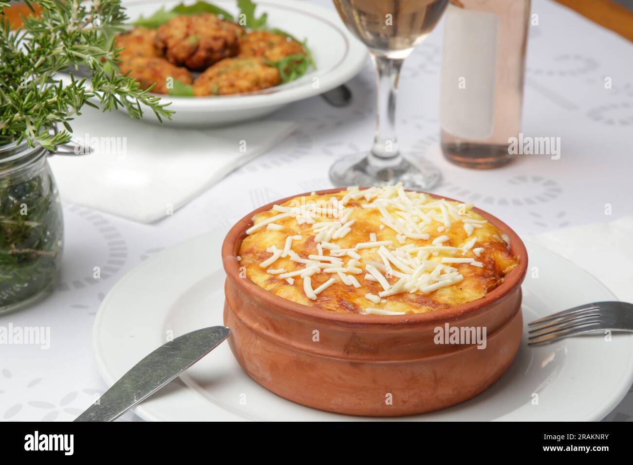 Traditional greek moussaka prepared in clay pot Stock Photo - Alamy