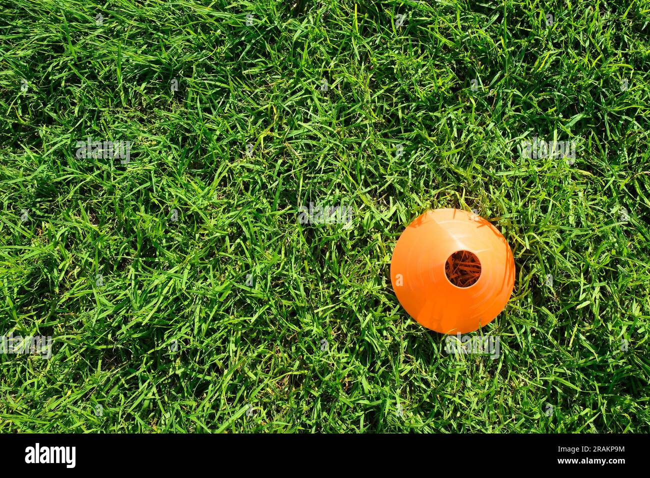 Top view orange plastic sports cone, field and course markers used in ...