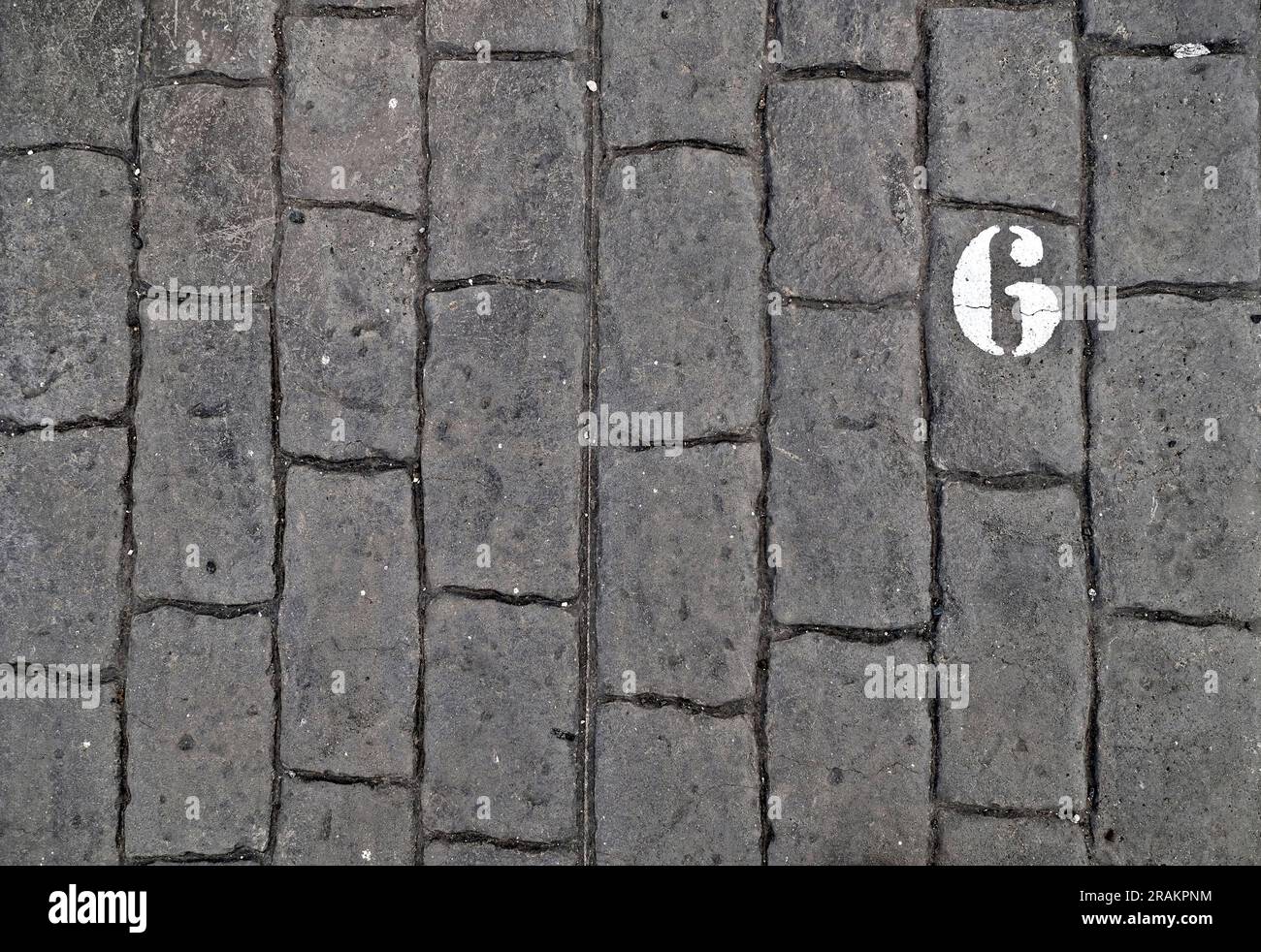 6, number six, white stencil number on cobblestone surface Stock Photo ...