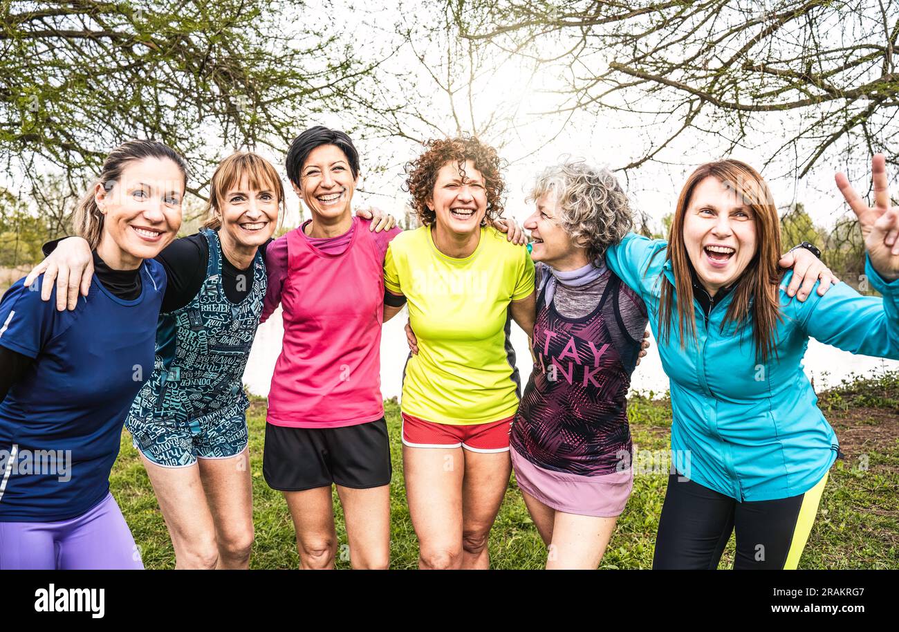 Happy multi generational women having fun together at city park ...