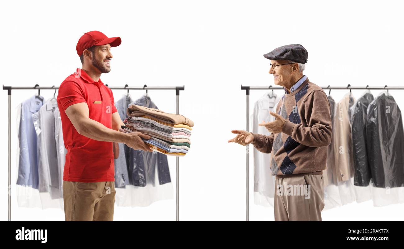 Man delivering dry cleaned clothes to an elderly customer isolated on a ...