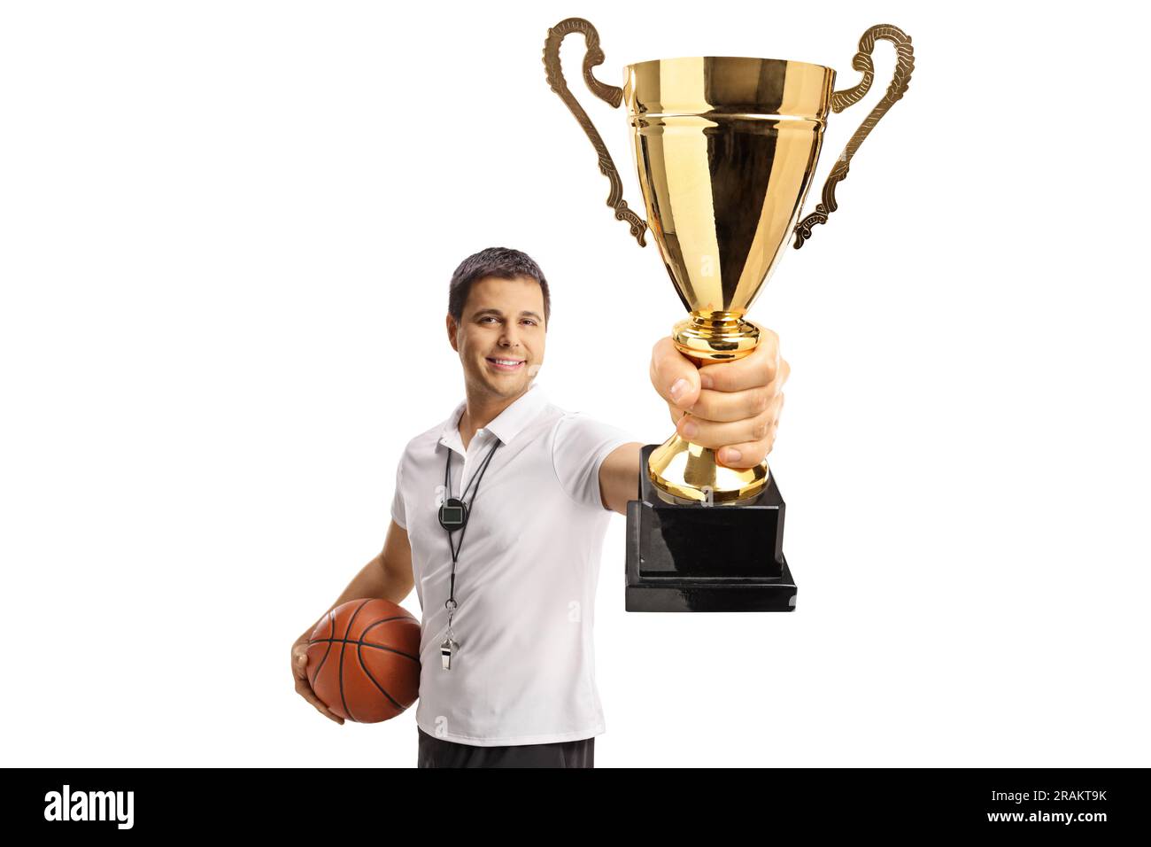 Basketball coach holding a ball and showing a gold trophy cup isolated ...