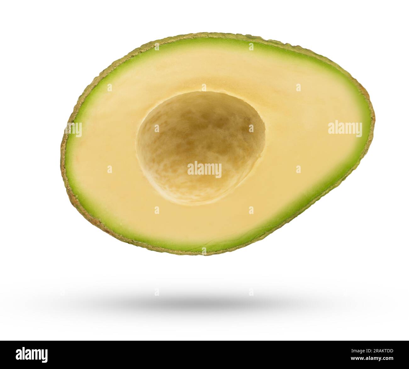 Half of an avocado on a white isolated background. Avocado with pitted ...