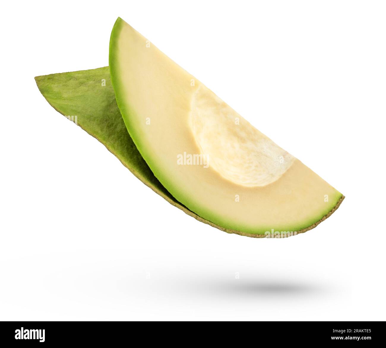 A slice of fresh avocado on a white isolated background. A slice of ...