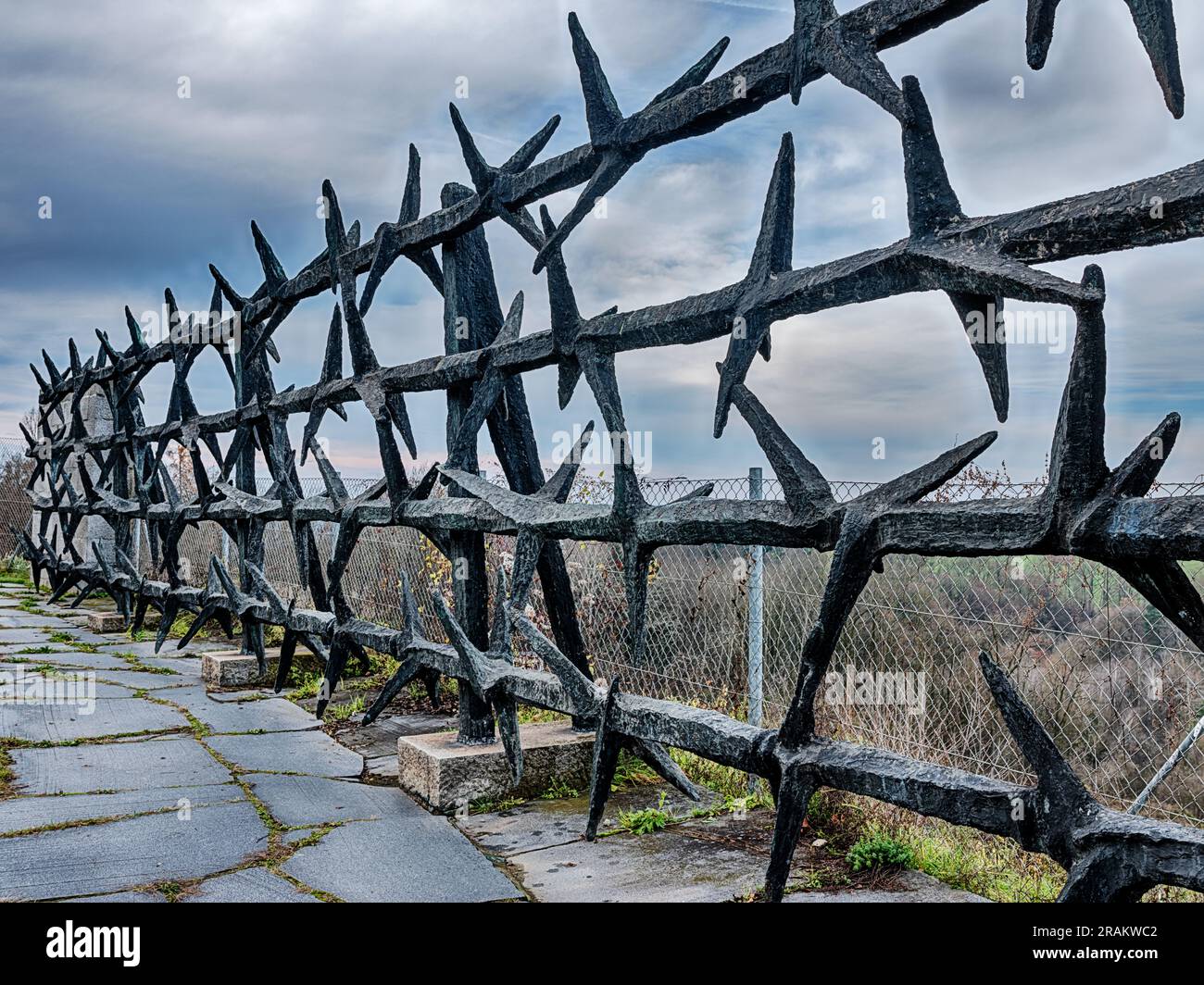 MAUTHAUSEN, AUSTRIA - DECEMBER 4, 2022: A steel, barbed wire fence is ...