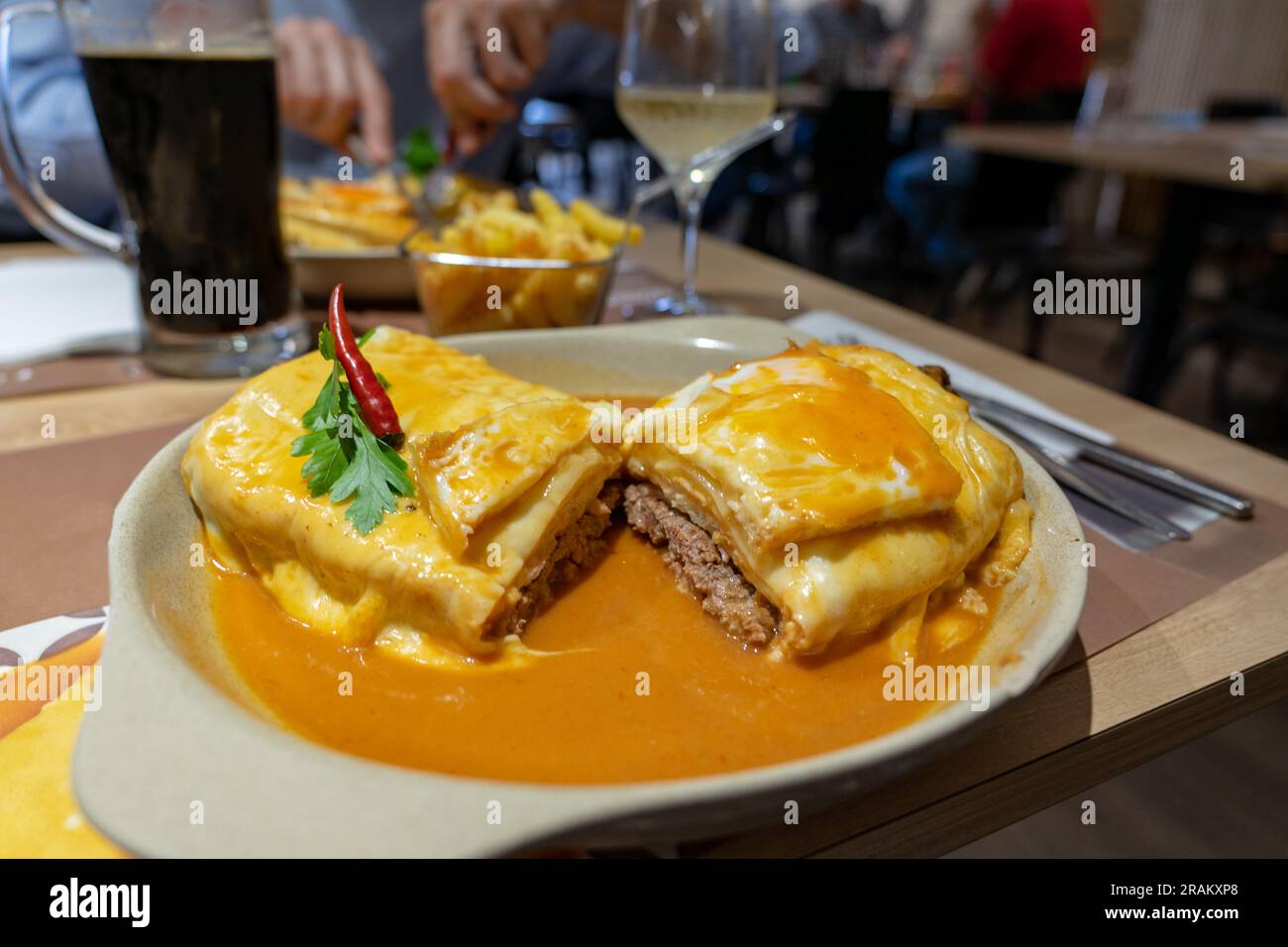 traditional delicious portuguese francesinha in a restaurant in Porto ...