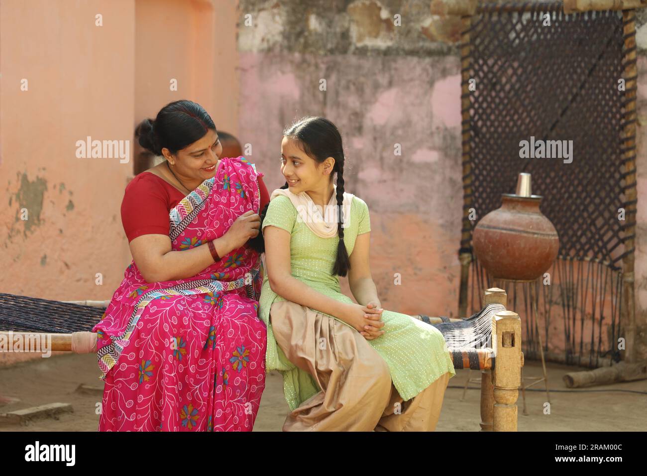 Portrait of Indian rural farmer family of a mother and a daughter ...