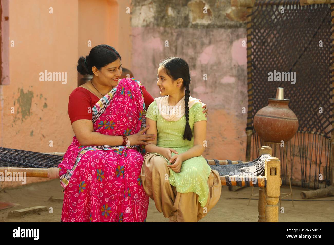 Portrait of Indian rural farmer family of a mother and a daughter ...