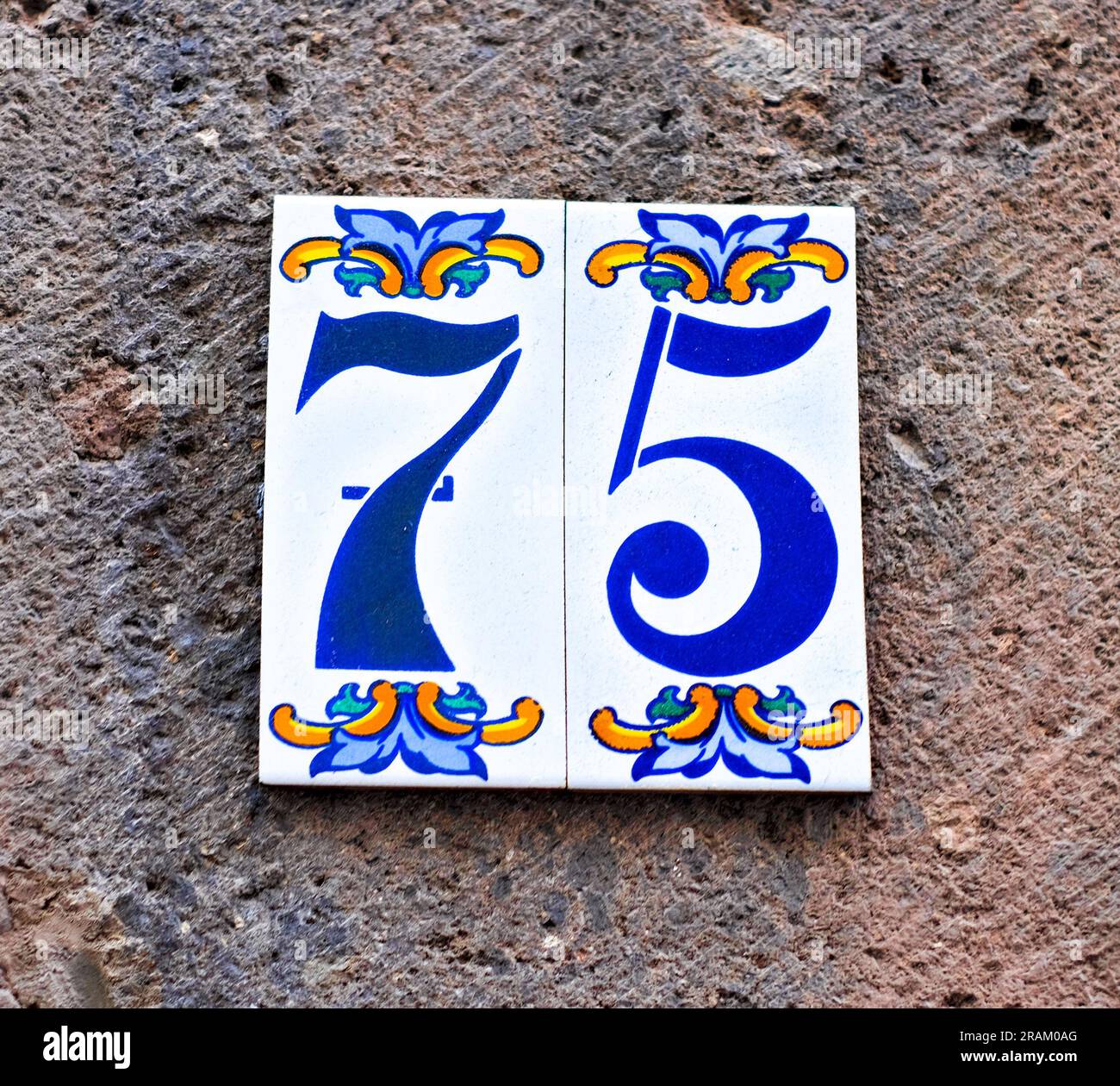 75, number seventy-five, decorative tilework on gray surface Stock ...