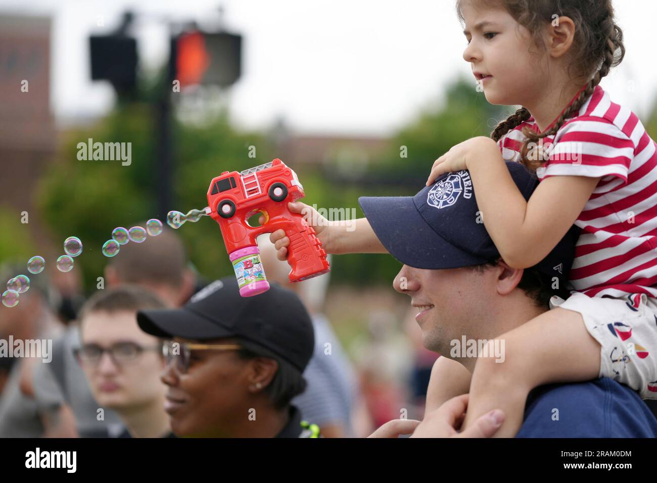 Madeline Couper, four years old, blows bubbles on the Fourth of July ...
