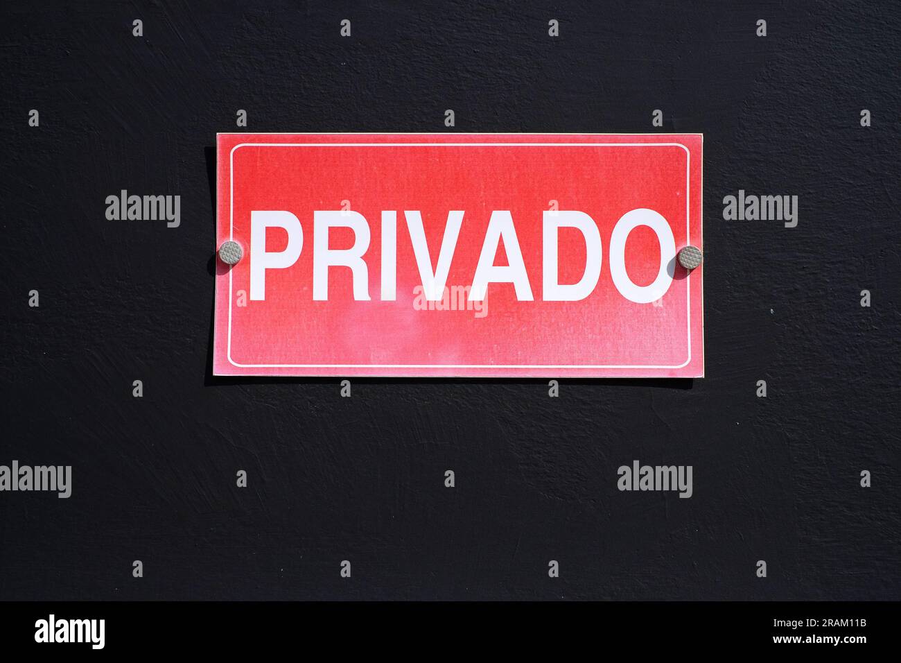 Private (Spanish: privado, English: private) red warning label on a ...