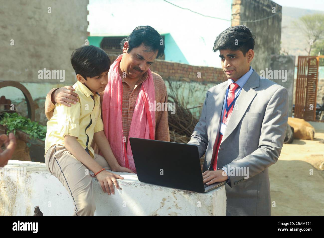 Happy Indian village family sitting with the banker or financial ...