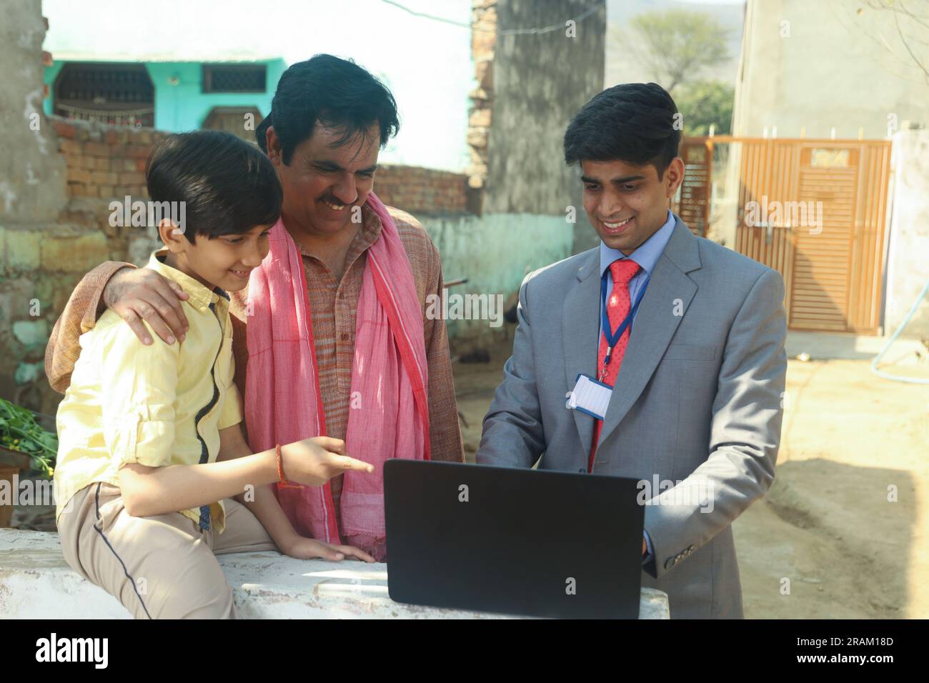 Happy Indian village family sitting with the banker or financial ...