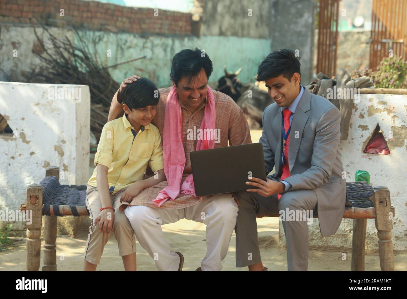 Happy Indian village family sitting with the banker or financial ...