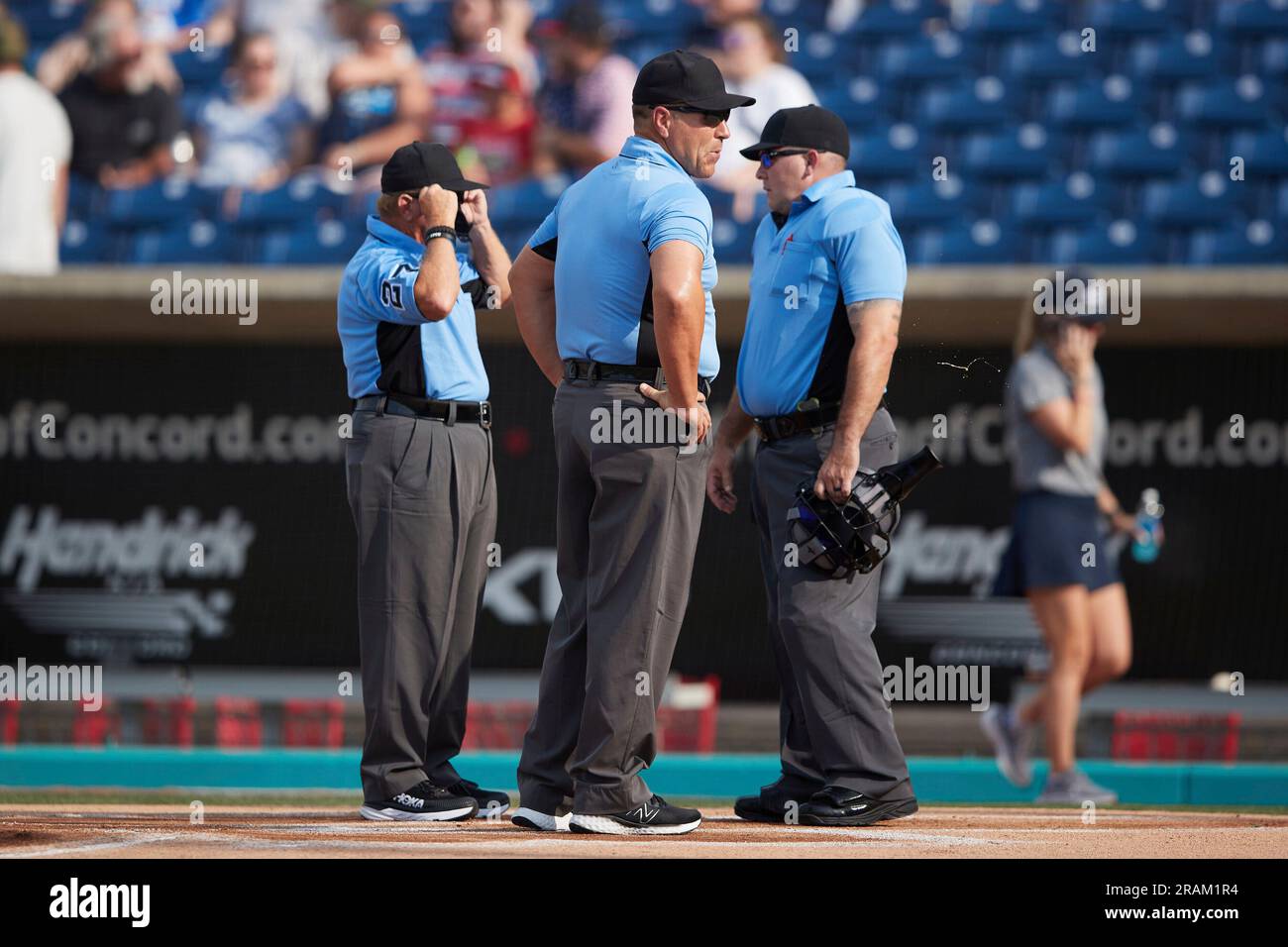 (L-R) Umpires Brent Cardwell, Steve Sanders and Dennis Meshaw stand at ...
