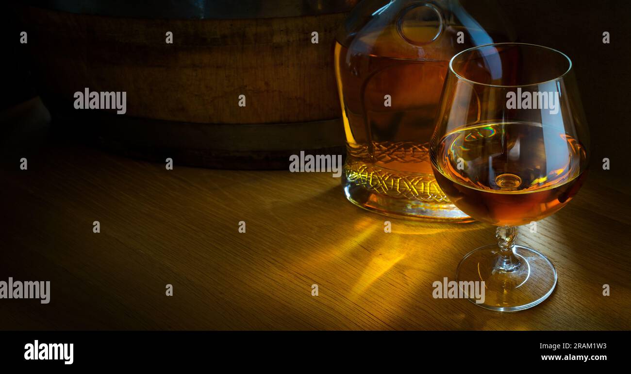 brandy glass; bottle and barrel; luxurious men's club banner background ...