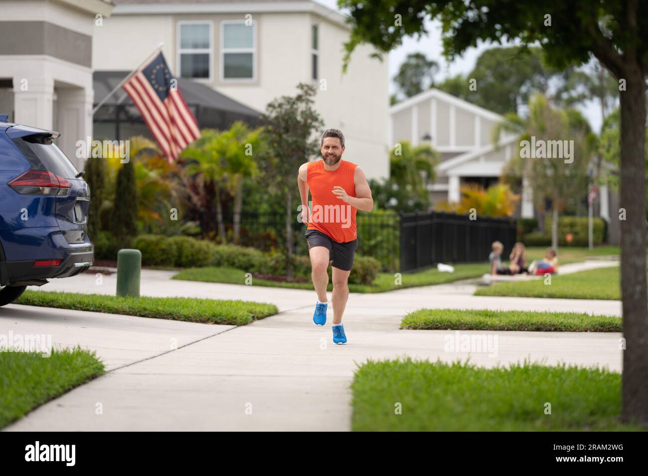sport fit man jogging outdoor. The running man races down the ...