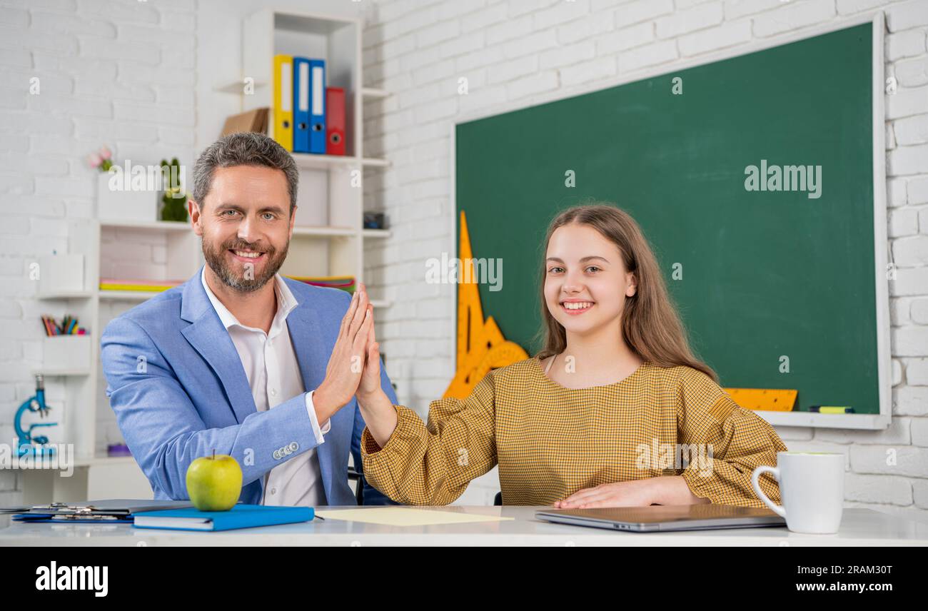 happy teen child study in classroom with tutor Stock Photo - Alamy