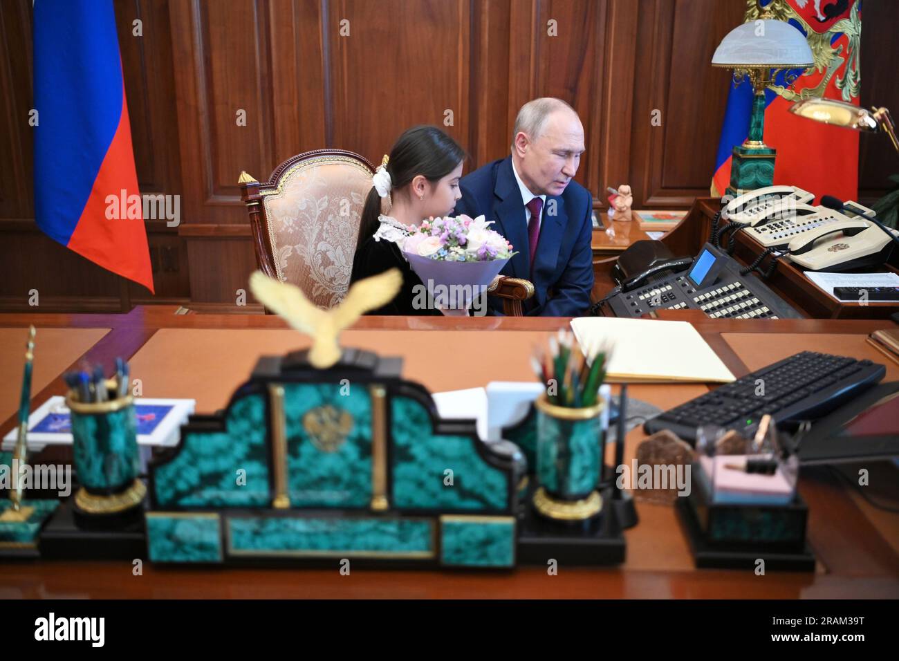 Russian President Vladimir Putin shows 8 year old Raisat Akipova, from ...