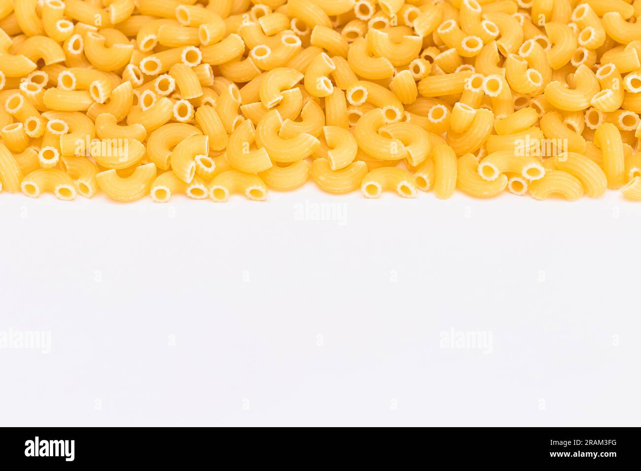 Uncooked Chifferi Rigati Pasta Scattered on White Table. Fat and ...
