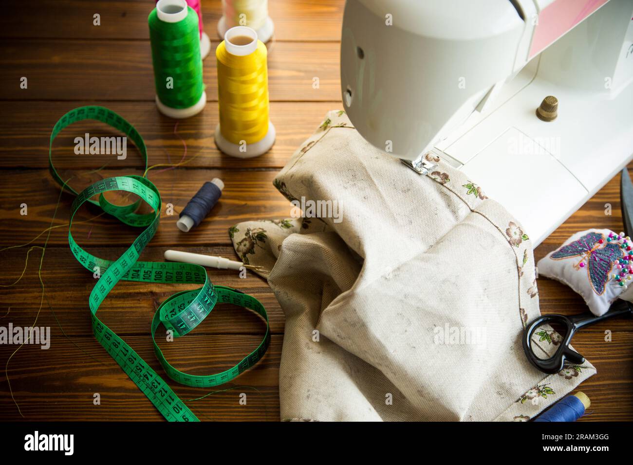 Sewing machine with fabric and threads for sewing, close-up. The ...