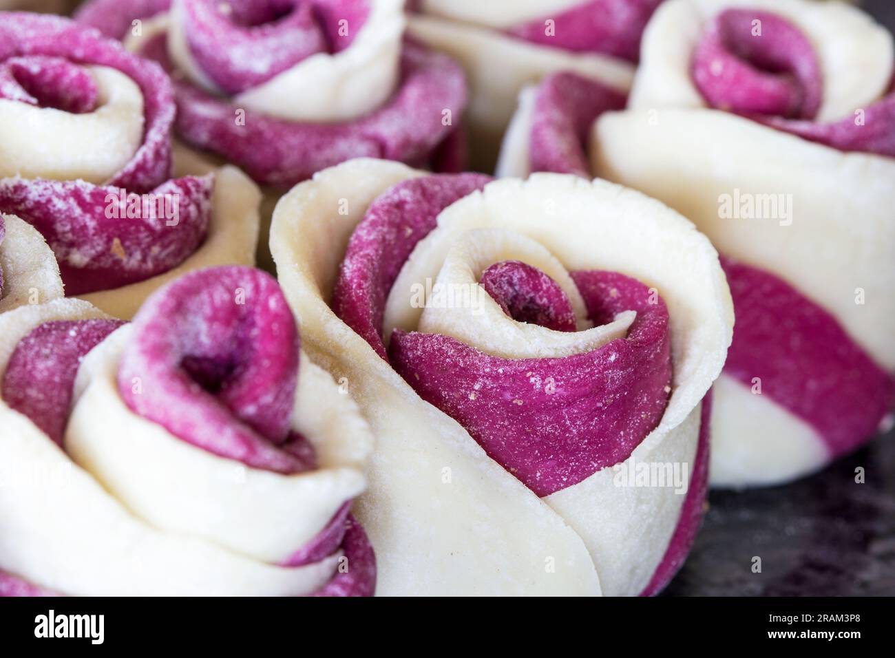 closeup of steamed buns in creativce rose form - raw before steaming ...