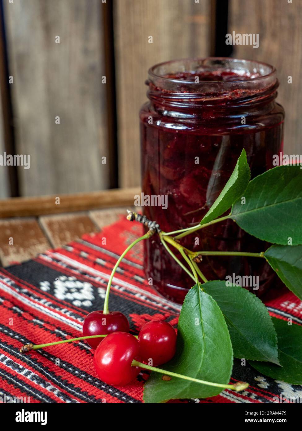 jar with homemade sour cherry jam Stock Photo - Alamy