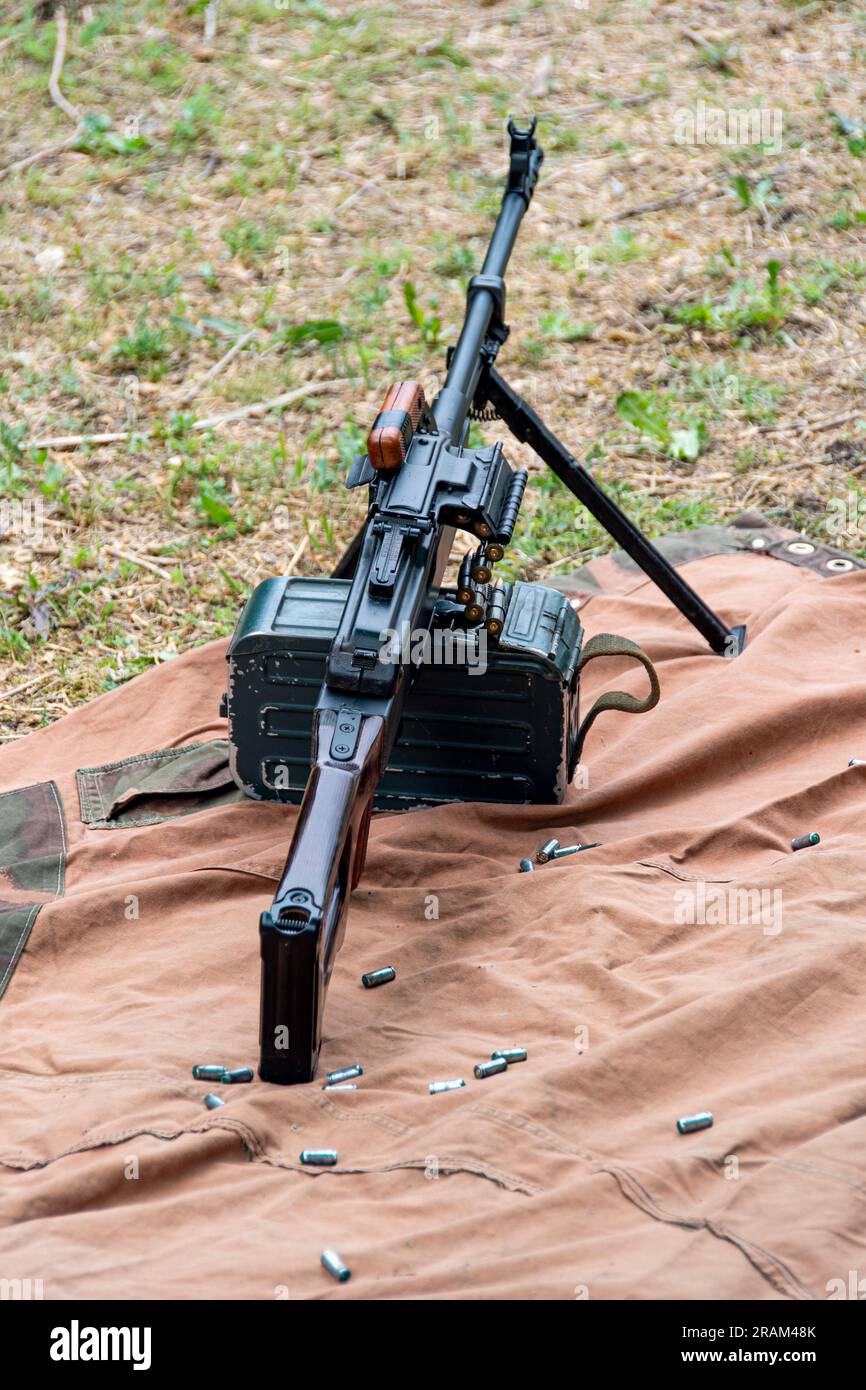 Soviet-made PK machine gun and camouflage netting.. "Kalashnikov's ...