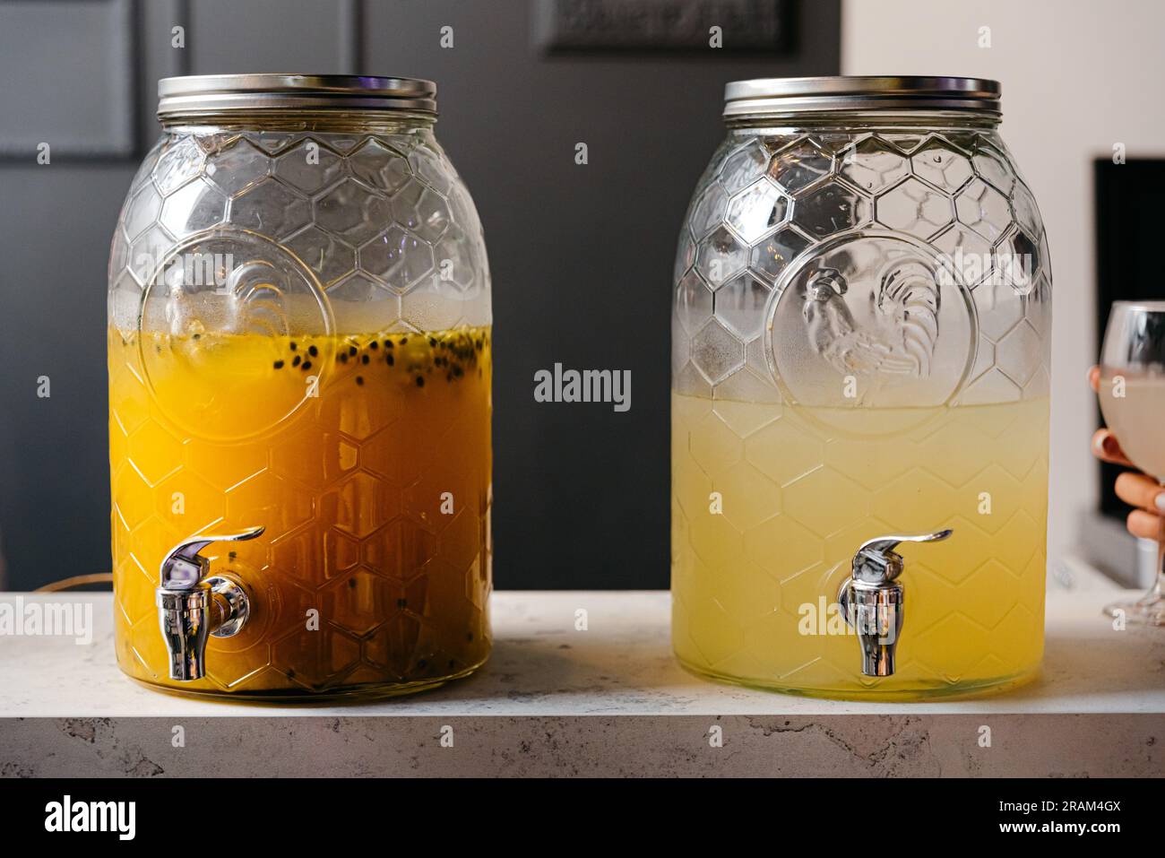 Passion fruit lemonade. Two glass containers with lemonade. A yellow ...