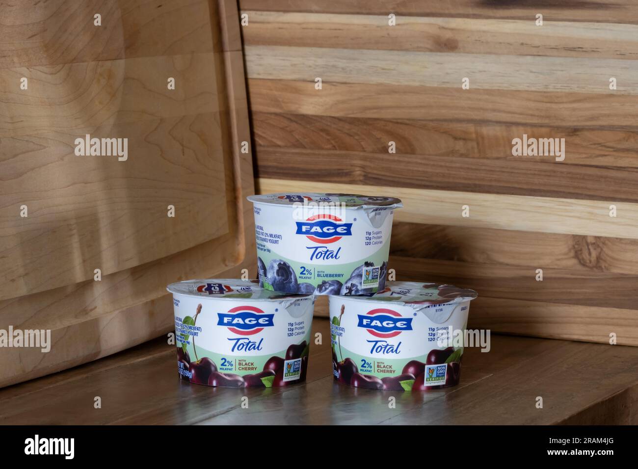 stacked packages of Fage brand greek yoghurt or yogurt in cherry and ...