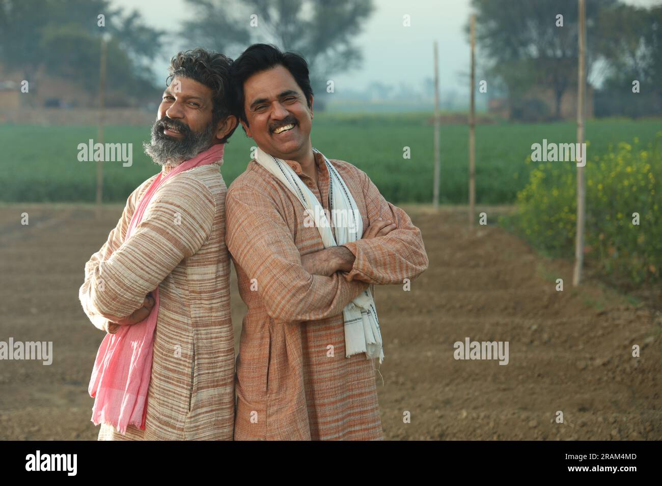 Farmers father and son standing together in the mustard crops hi-res stock photography and ...