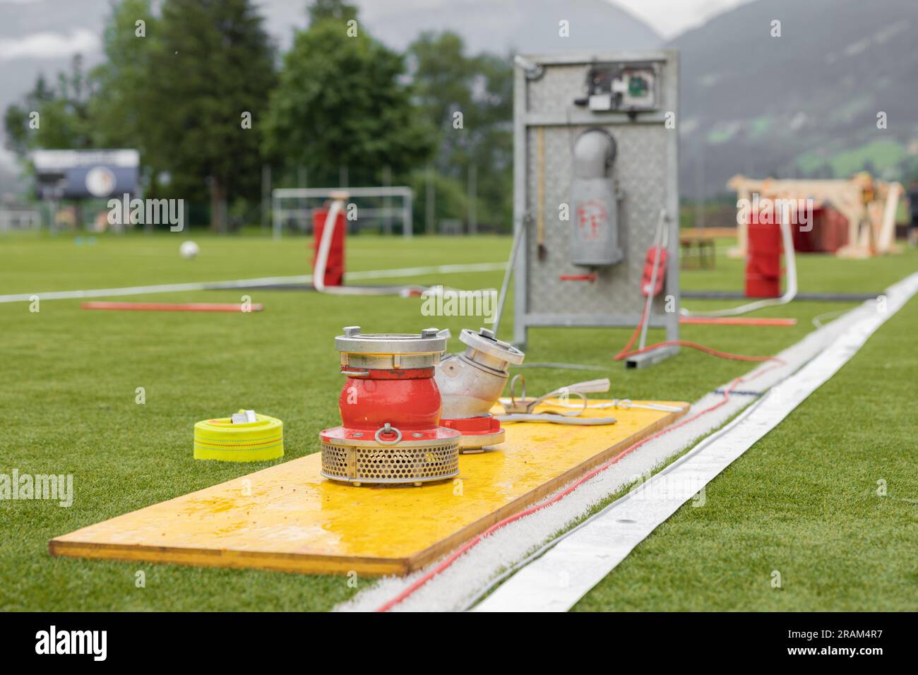Equipment laid out on a green field for training of fire brigades Stock ...