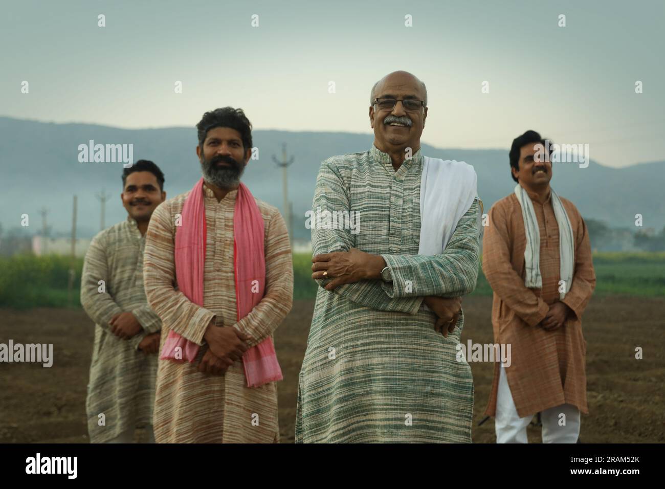 Beautiful portrait composition of Indian farmers standing in field ...