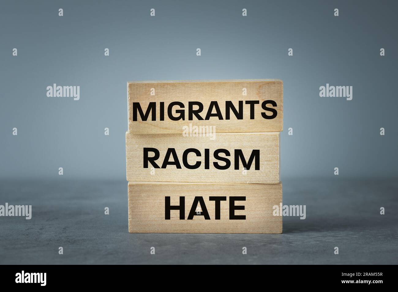 The problem of racism and hate migrants, Written on wooden blocks ...
