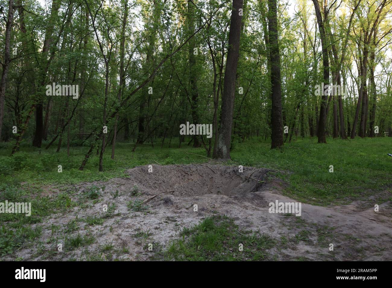 Missile impact crater in the park, ukraine, explosion in the park Stock ... Missile impact crater in the park, ukraine, explosion in the park Stock ...