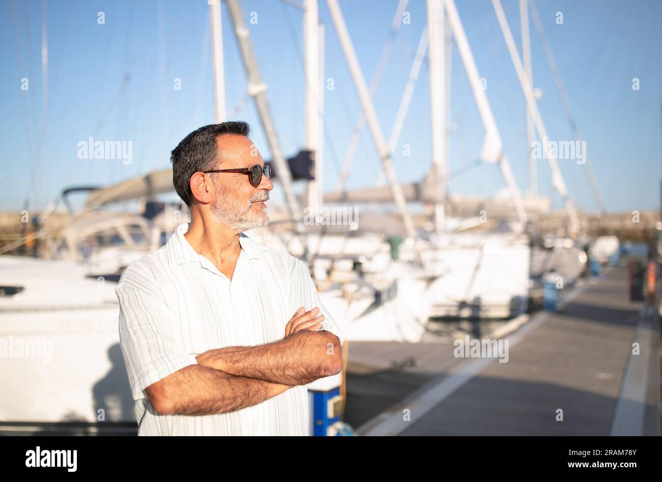 Senior Gentleman Posing With Boats In Yacht Park, Copy Space Stock ...