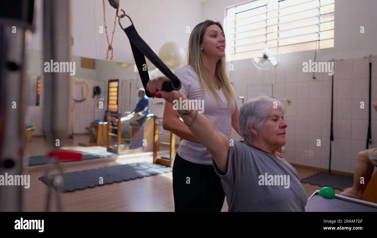 Senior Woman Participating in Pilates Session with Female Coach ...