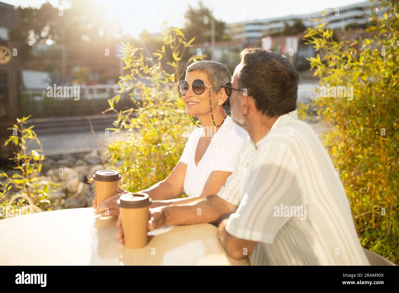 Side View Of Mature Spouses Enjoying Coffee At Outdoor Cafe Stock Photo ...