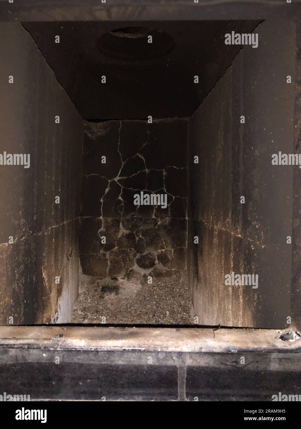 Broken firebrick in a tiled stove Stock Photo - Alamy