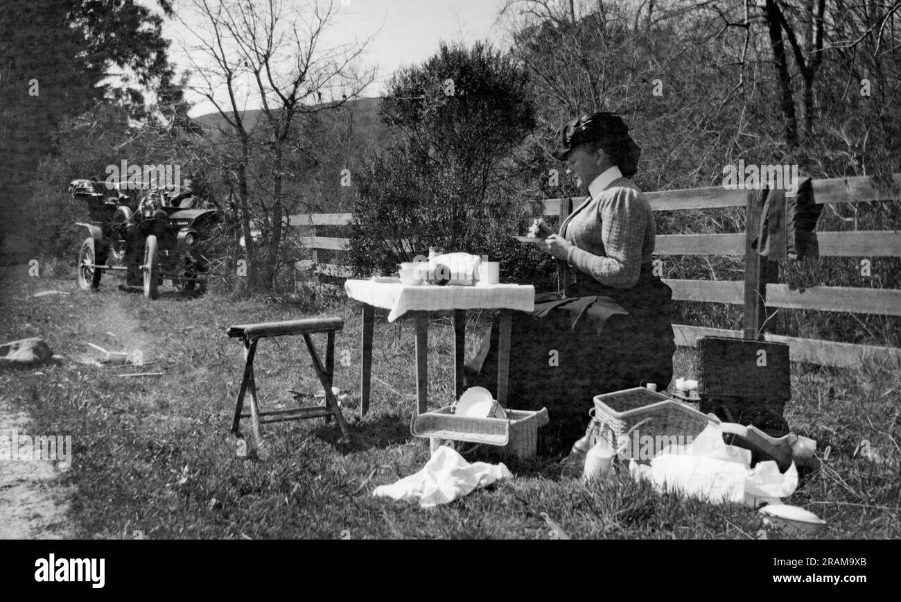 Portola Valley, California: May, 1908. A woman in Victorian dress sits ...