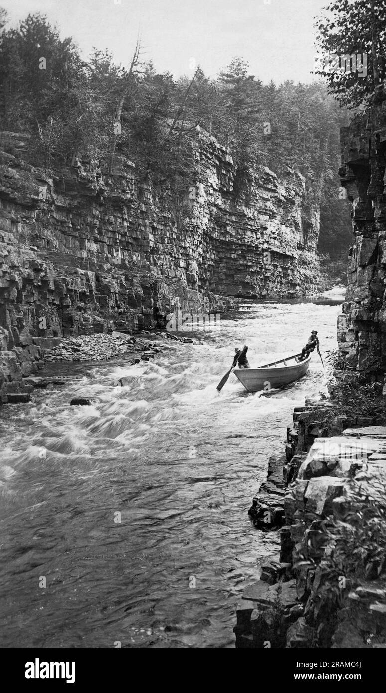 Ausable Chasm, New York: July 1894 Two men in a boat running the rapids ...