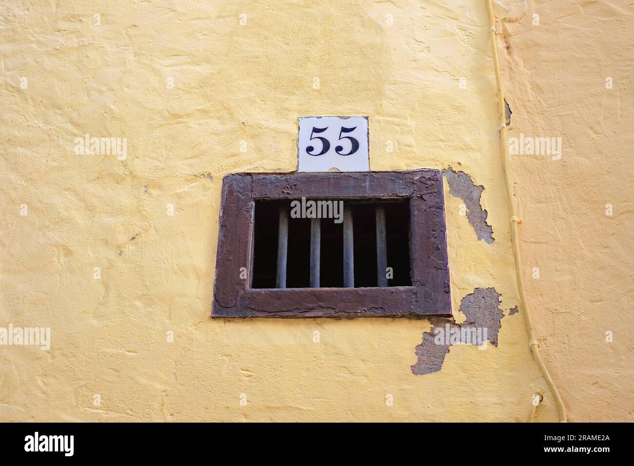 Prison cell with a barred window, empty space for text, banner or ...
