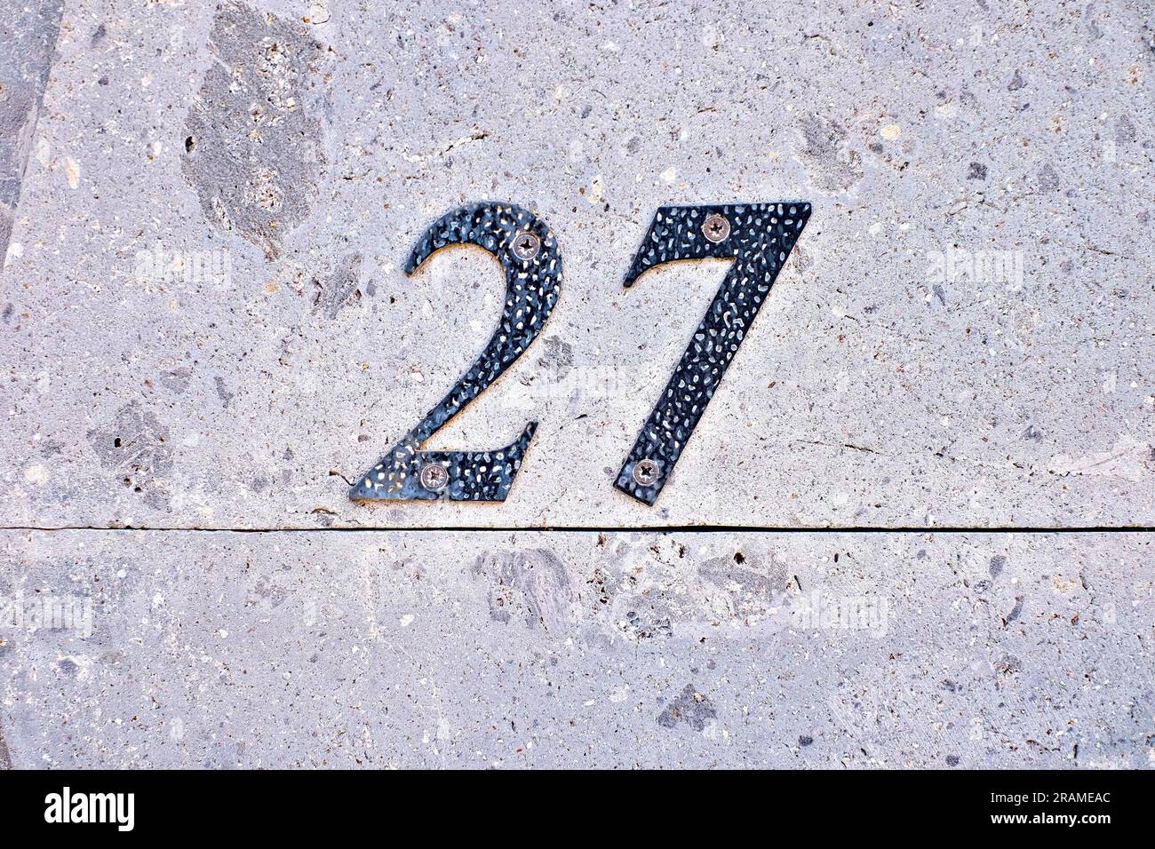 Number 27, twenty-seven, metal number on stone background Stock Photo ...