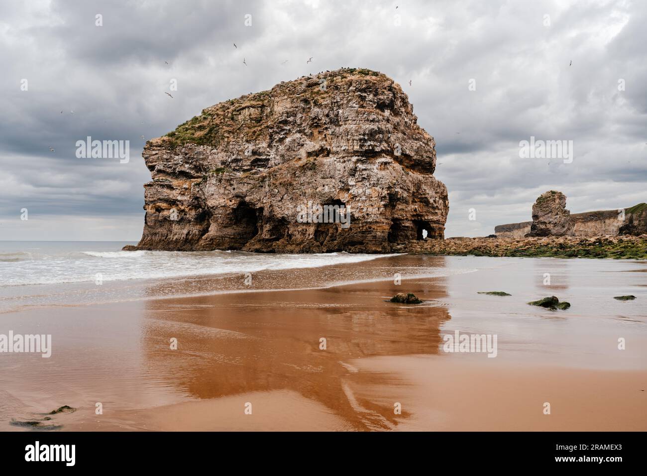 Marsden Rock in Marsden Bay, South Shields, with tide slowly coming in ...