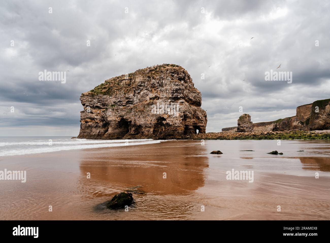 Marsden Rock in Marsden Bay, South Shields, with tide slowly coming in ...