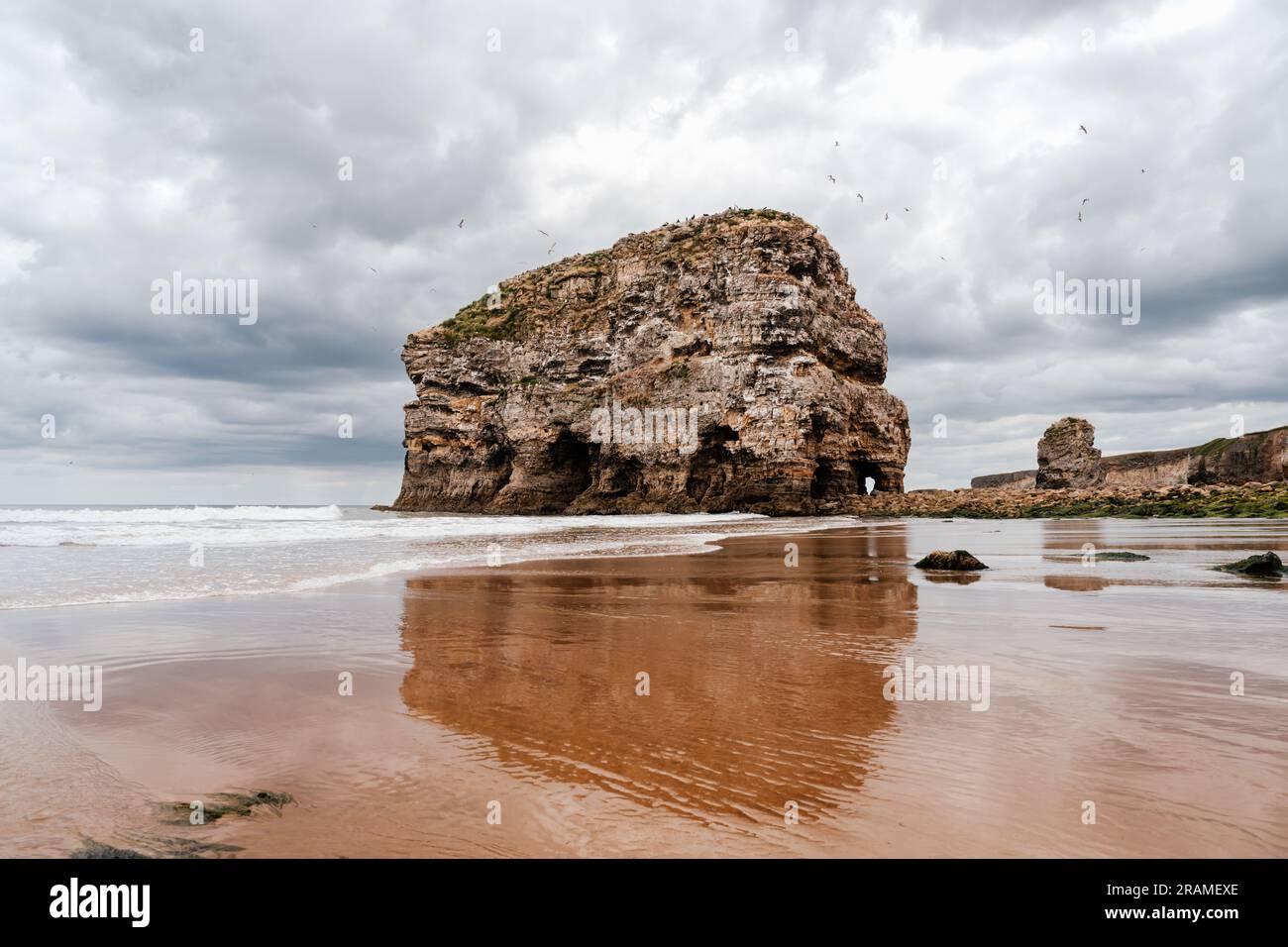 Marsden Rock in Marsden Bay, South Shields, with tide slowly coming in ...