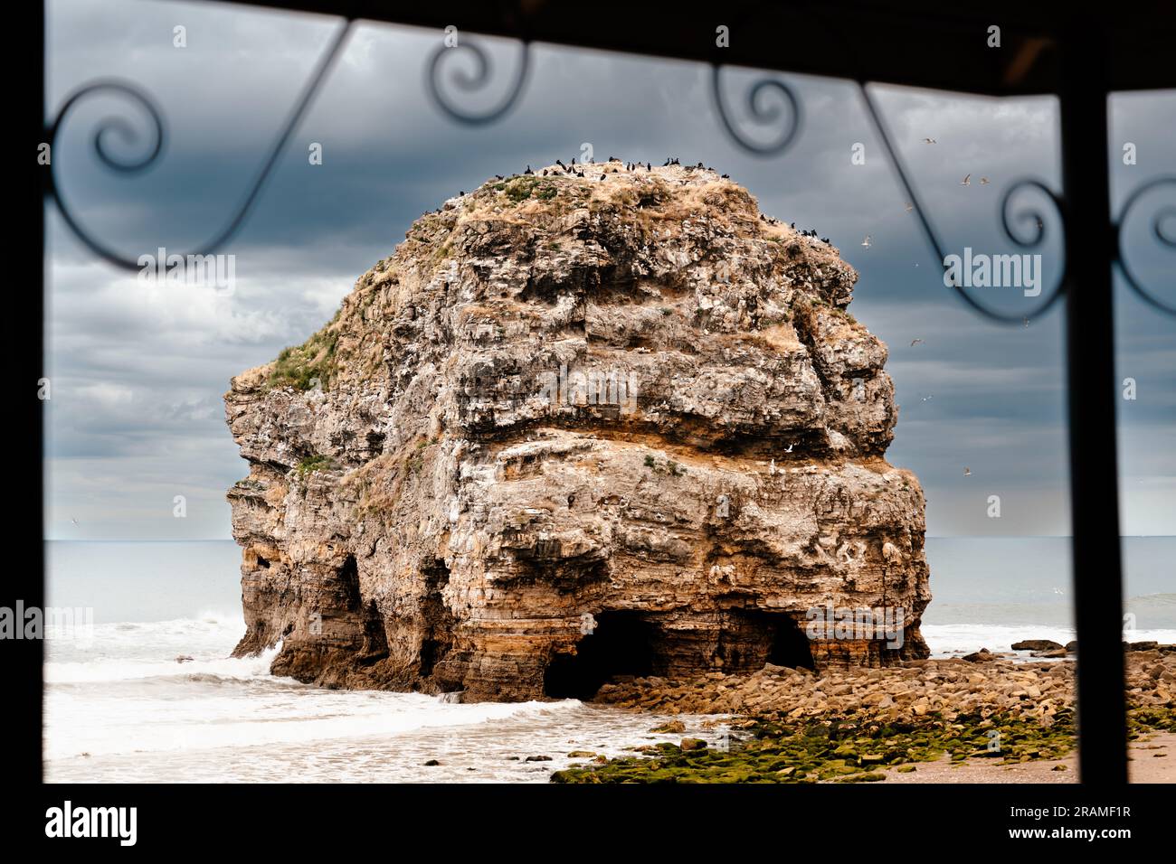 Marsden Rock in Marsden Bay viewed through the gazebo of Marsden Grotto ...