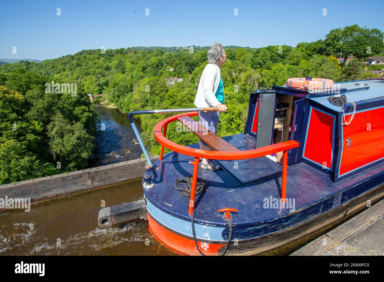 Canal narrowboat crossing 38 meters above the river Dee valley on the ...
