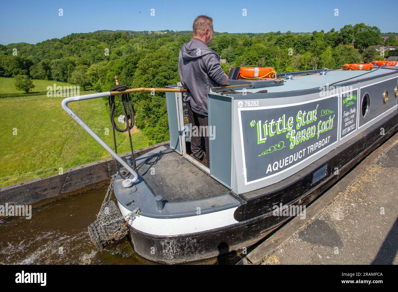 Canal narrowboat crossing 38 meters above the river Dee valley on the ...