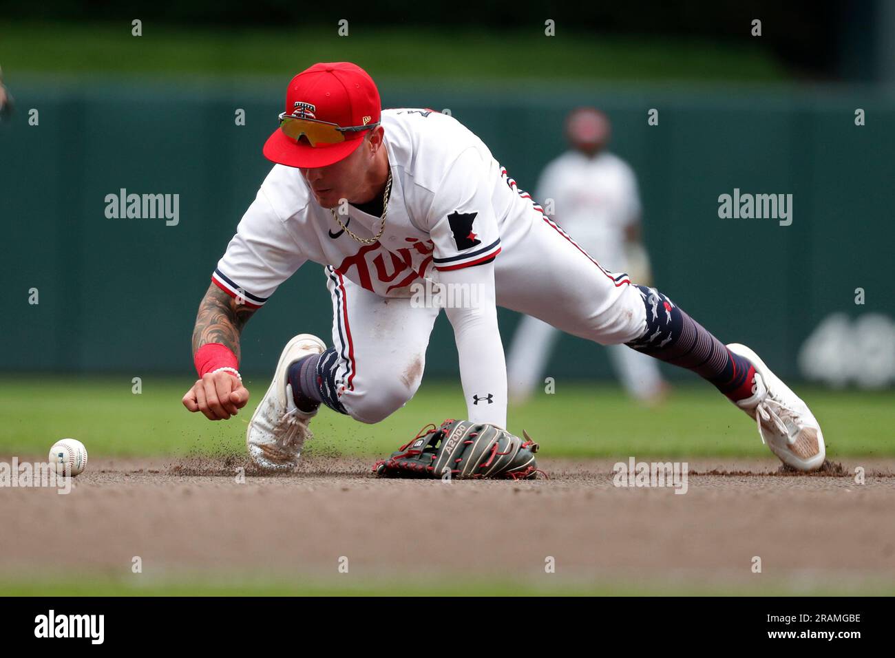 Minnesota Twins third baseman Jose Miranda bobbles a ball hit by Kansas ...